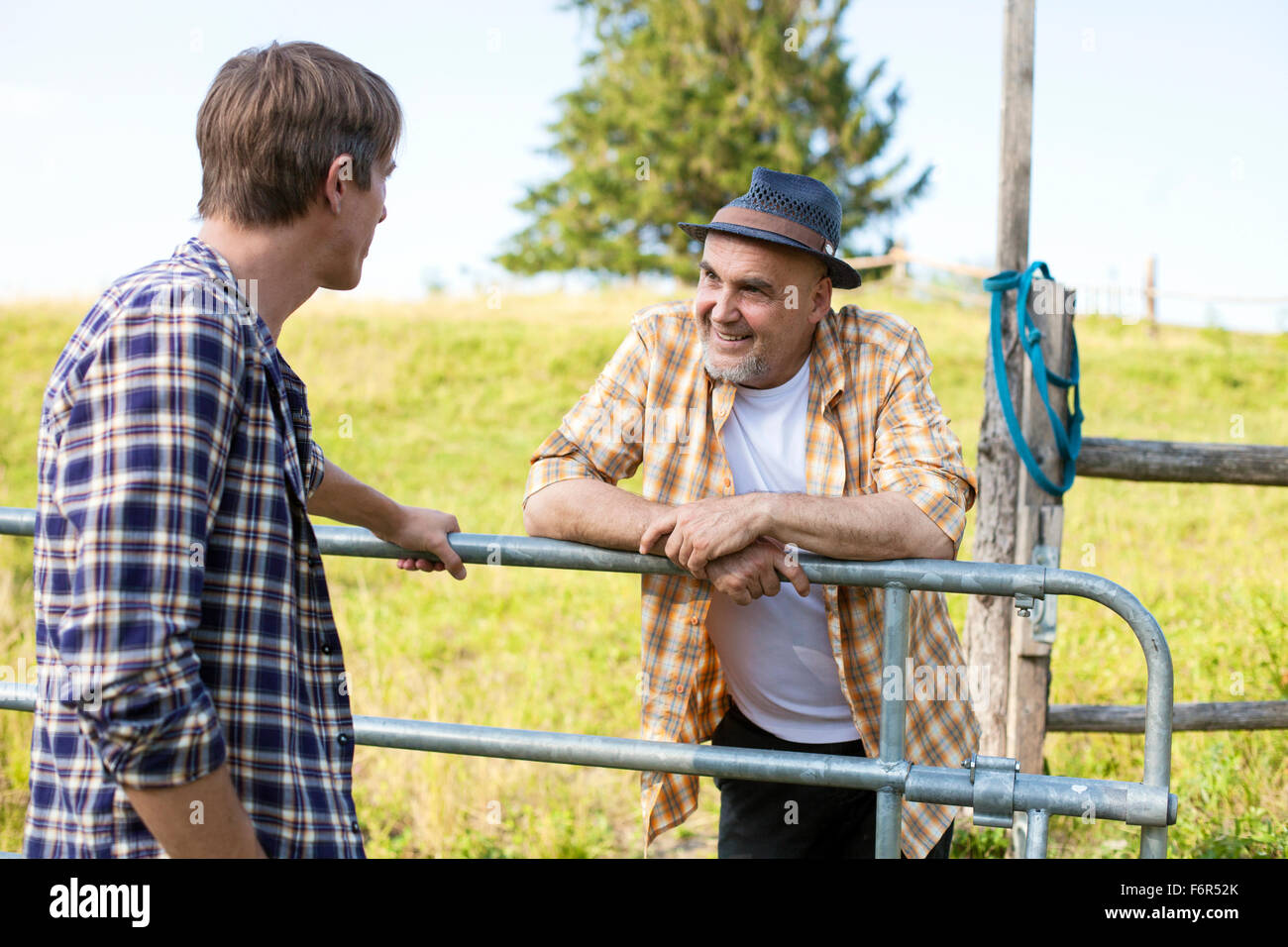 Two people fence talking hi-res stock photography and images - Alamy