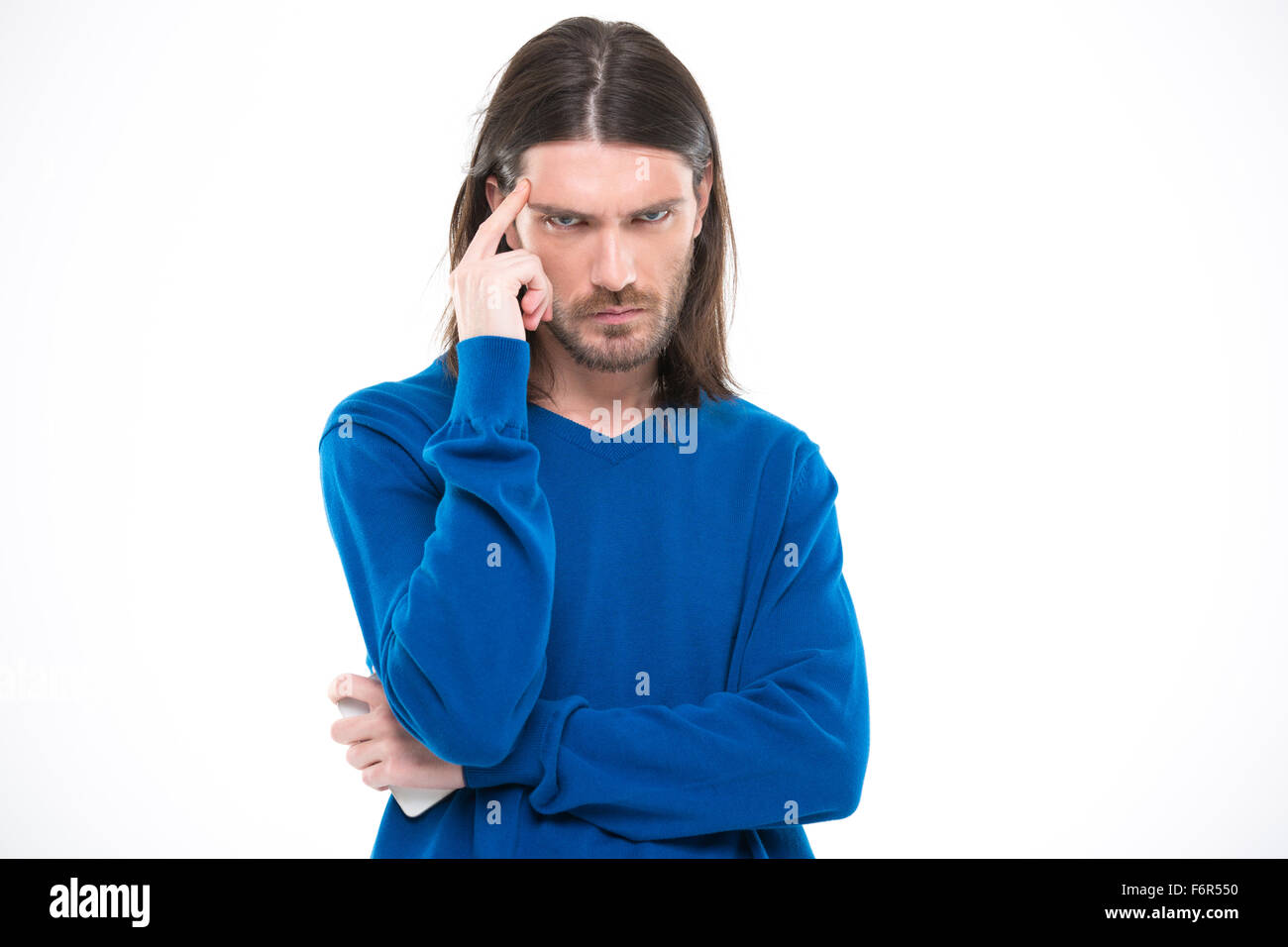 Angry mad man with long hair in blue pullover touching his temple Stock ...