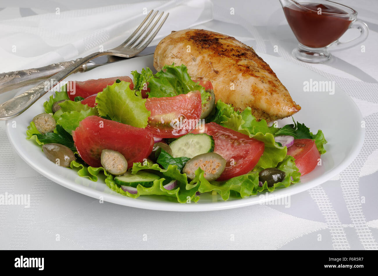 Easy garnish of fresh vegetables with chicken schnitzel Stock Photo - Alamy