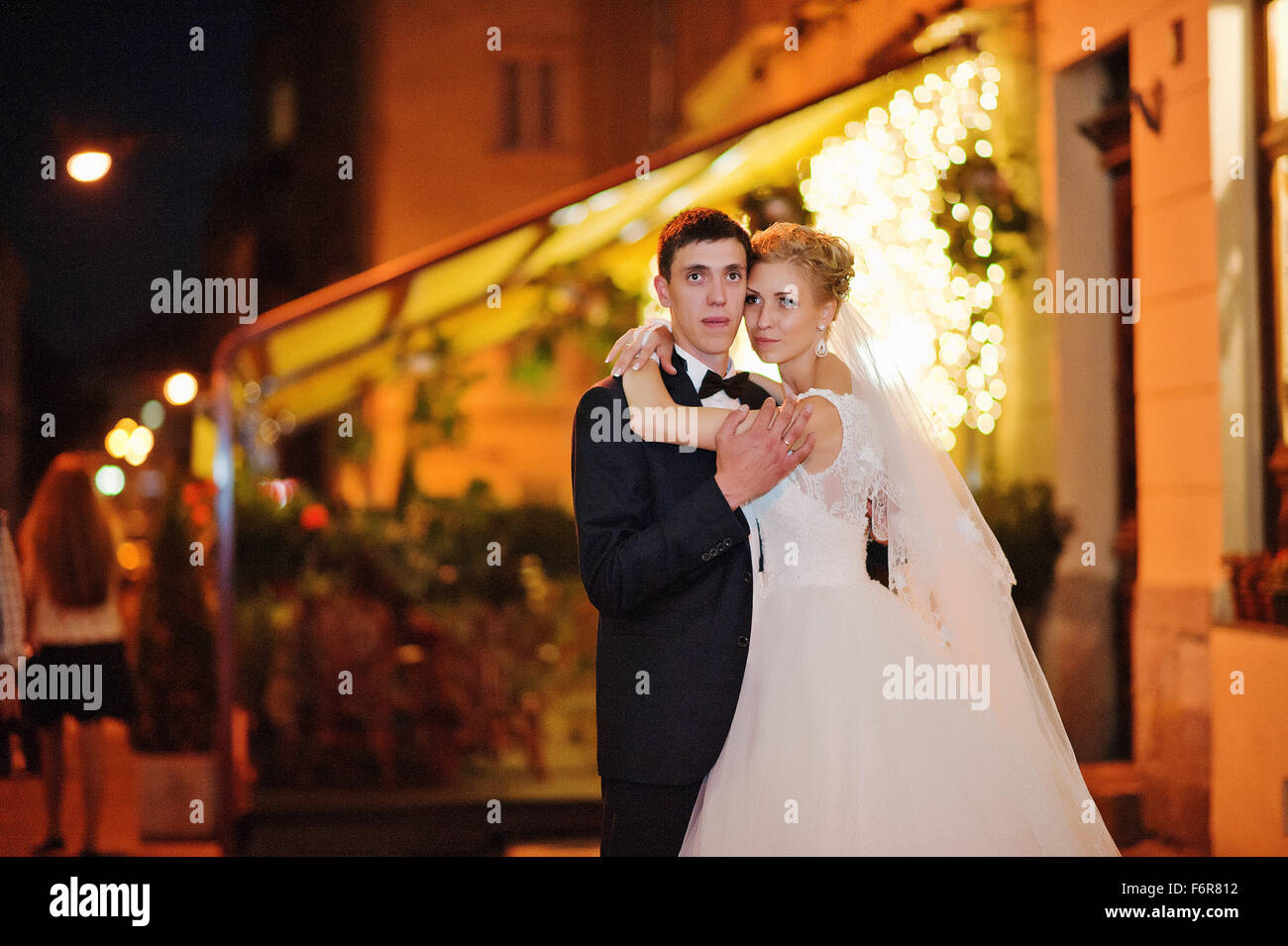 wedding couple in love on streets of evening Lviv, Ukraine Stock Photo ...