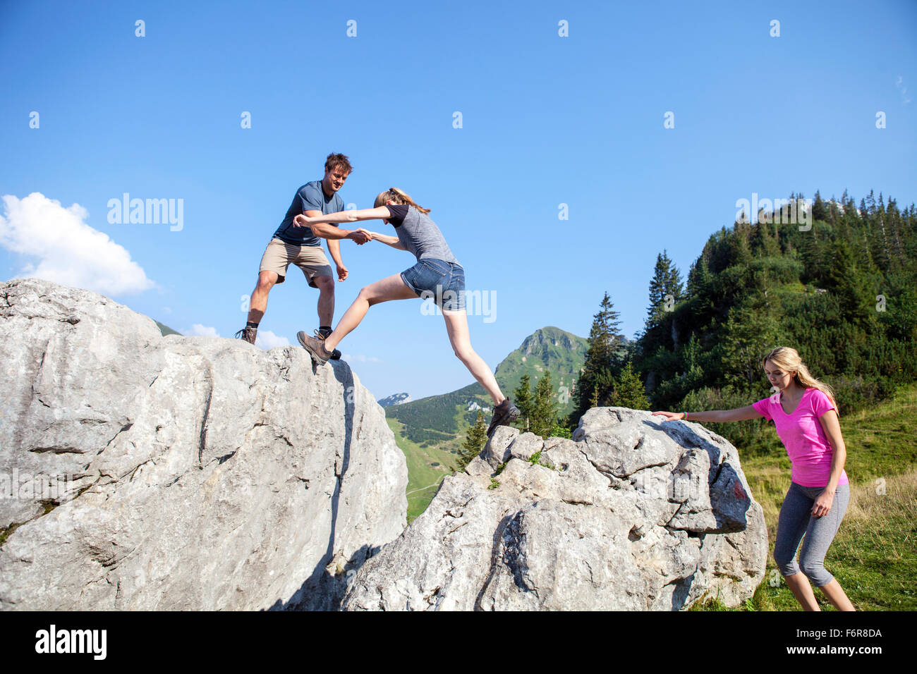 Group of friends hiking in mountain landscape Stock Photo - Alamy
