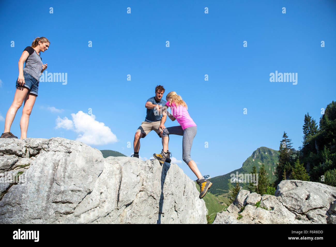 Group of friends hiking in mountain landscape Stock Photo - Alamy