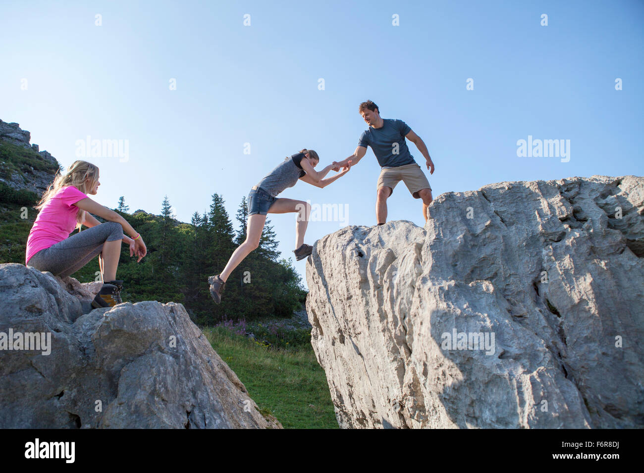 Group of friends hiking in mountain landscape Stock Photo - Alamy