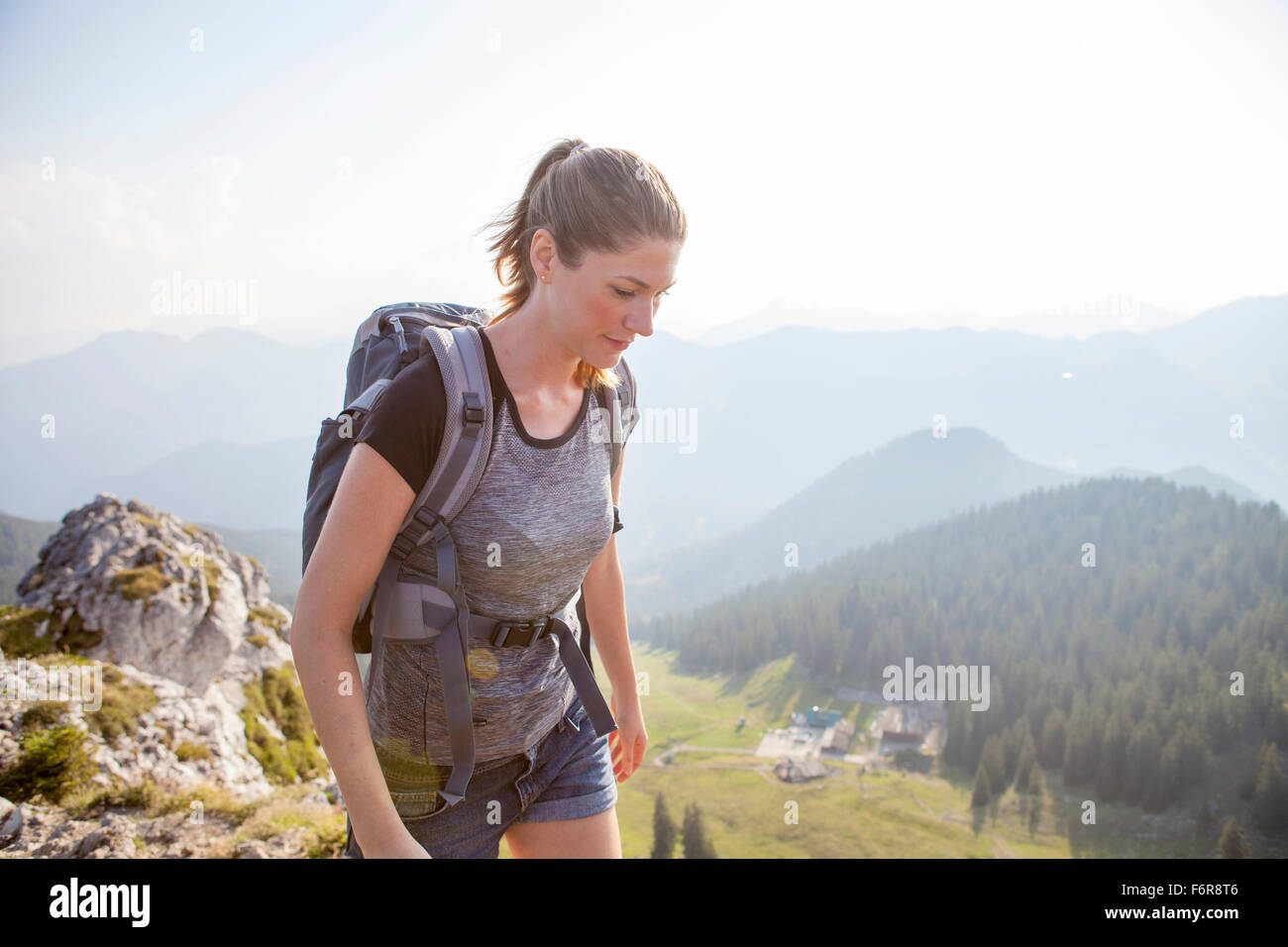 Young woman hiking in mountain landscape Stock Photo - Alamy