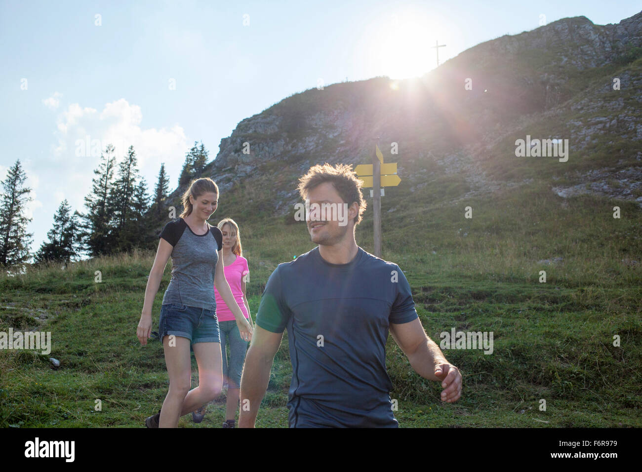 Group of friends hiking in mountain landscape Stock Photo - Alamy