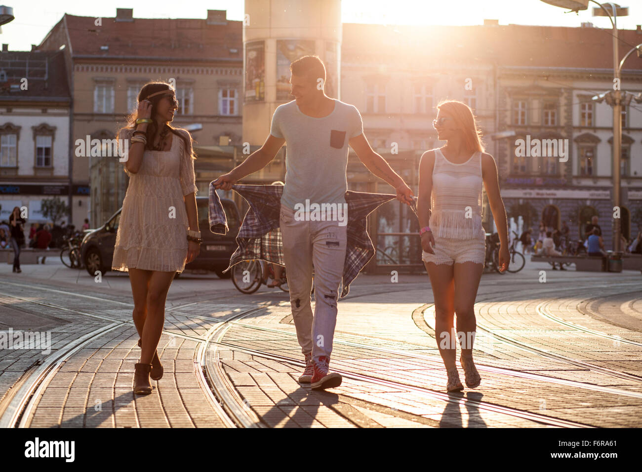 Young people in hippie style fashion walking on street Stock Photo - Alamy