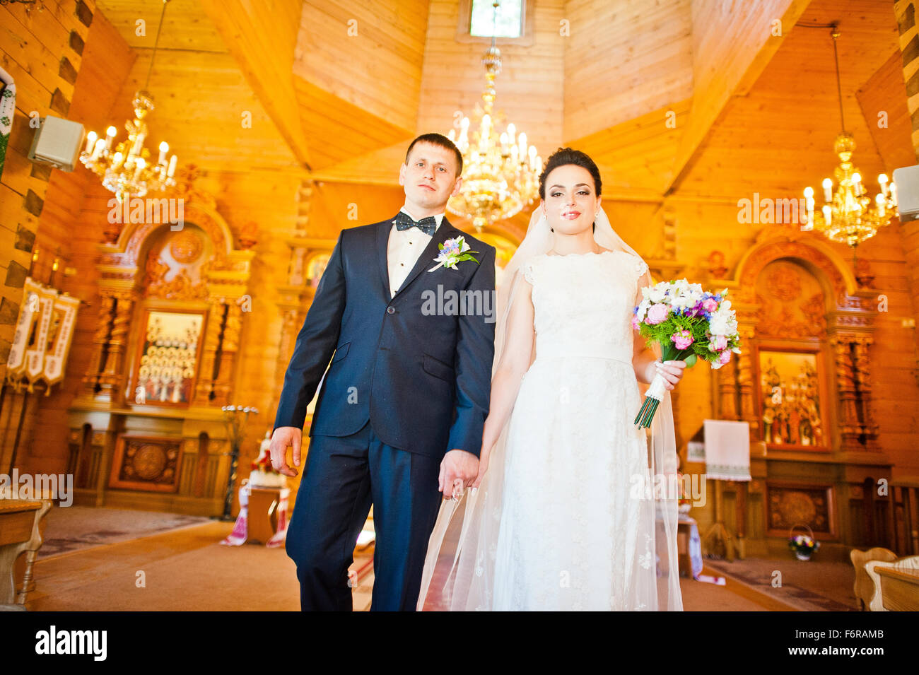 Wedding couple in church Stock Photo - Alamy
