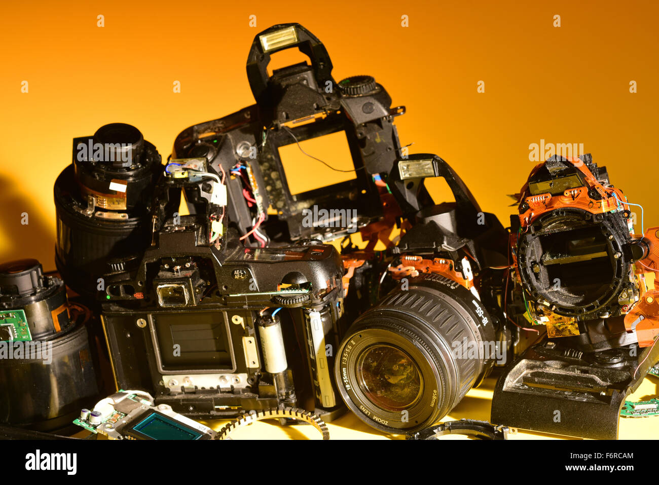 digital camera falling and shattering on wooden floor Stock Photo - Alamy