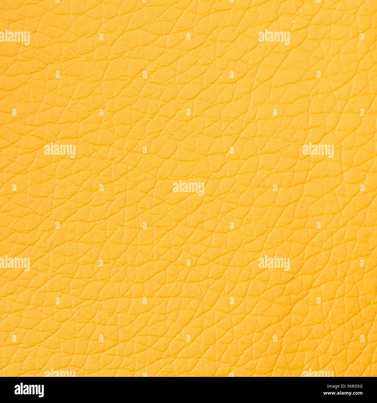 Closeup on yellow leather background Stock Photo - Alamy