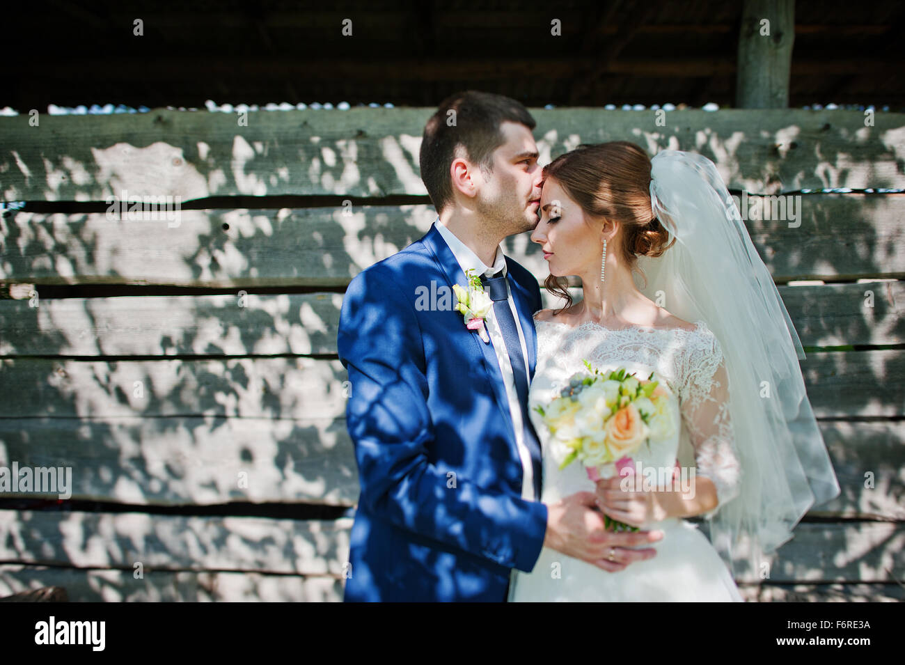 Marriage couple at the shadows of apple tree Stock Photo - Alamy