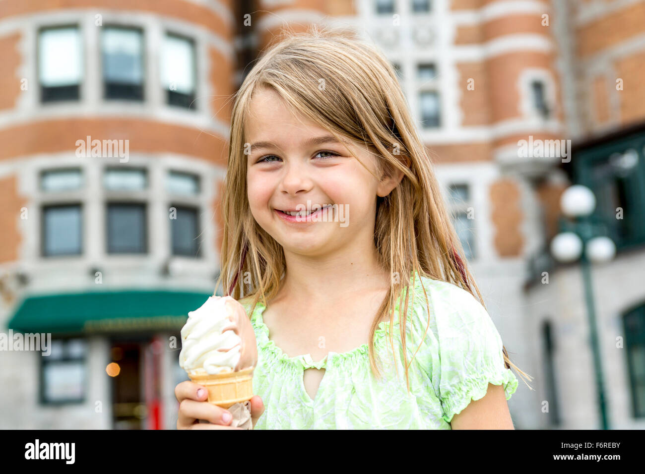 Cute Girl Eating Ice-Cream Stock Photo - Alamy