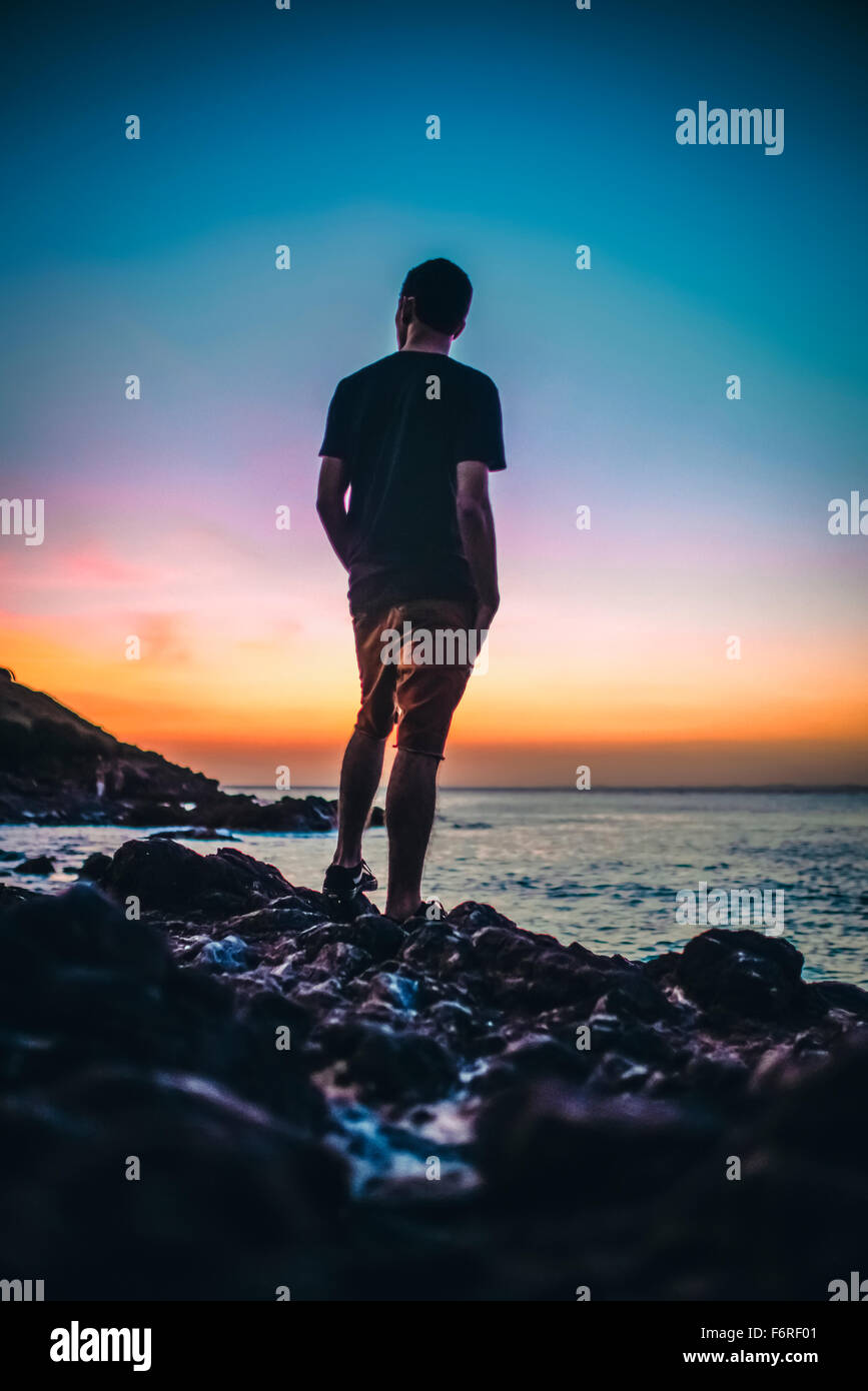 Boy at beach sunset hi-res stock photography and images - Alamy