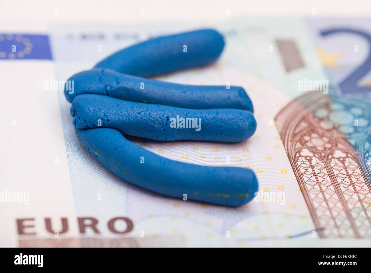 Plasticine euro icon on euro banknote Stock Photo - Alamy