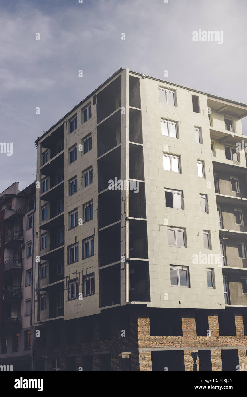 Unfinished generic residential building, construction site with no ...