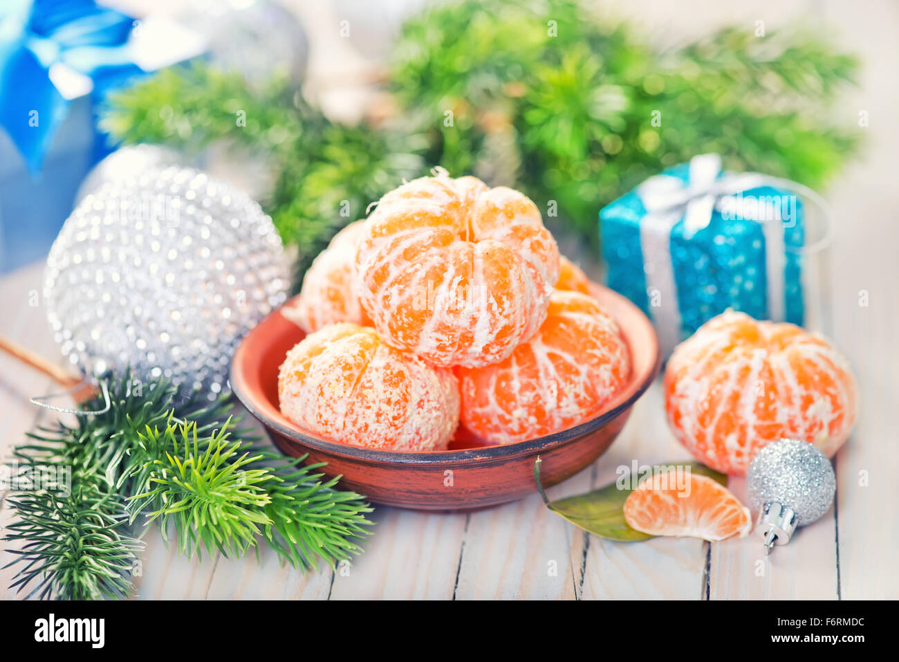 tangerines in basket and on a table Stock Photo - Alamy