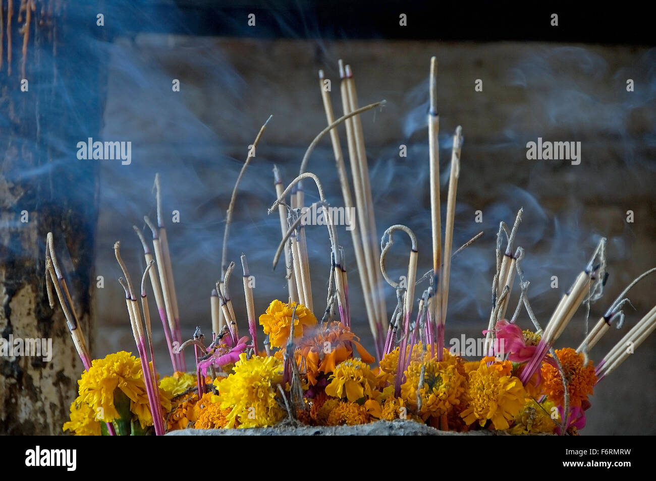 burning incense in Pac Ou Caves Laos Stock Photo - Alamy