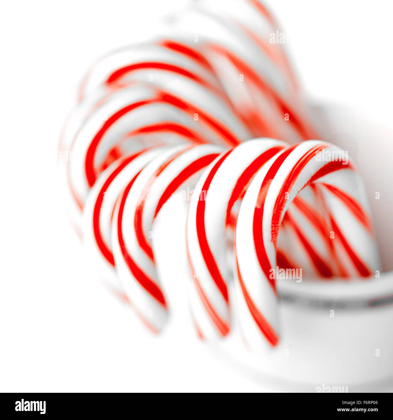 White and red peppermint candy canes in bucket Stock Photo - Alamy