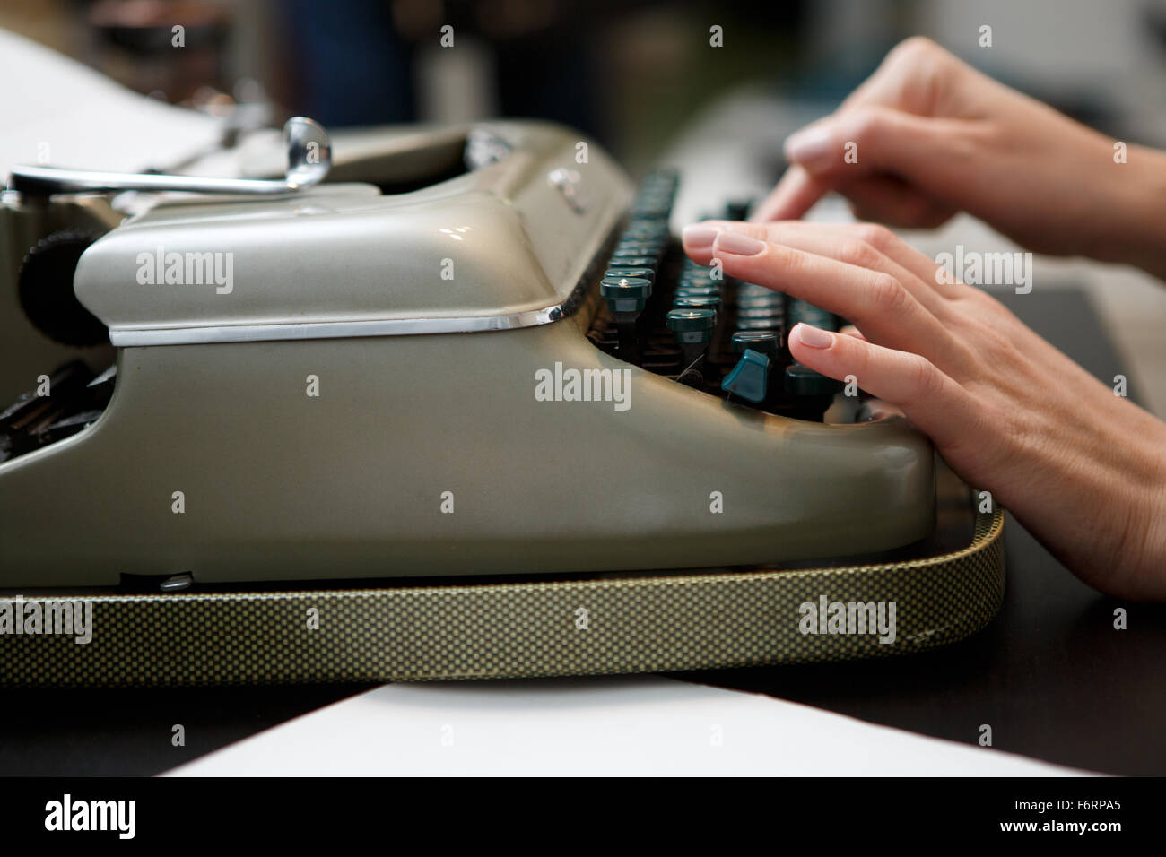 closeup of woman typing with old typewriter side view Stock Photo - Alamy