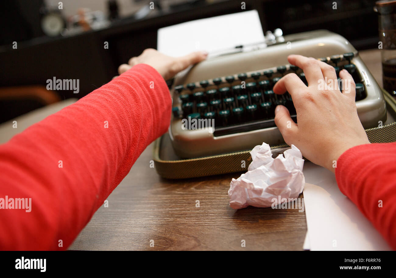 woman working on typewriter Stock Photo - Alamy