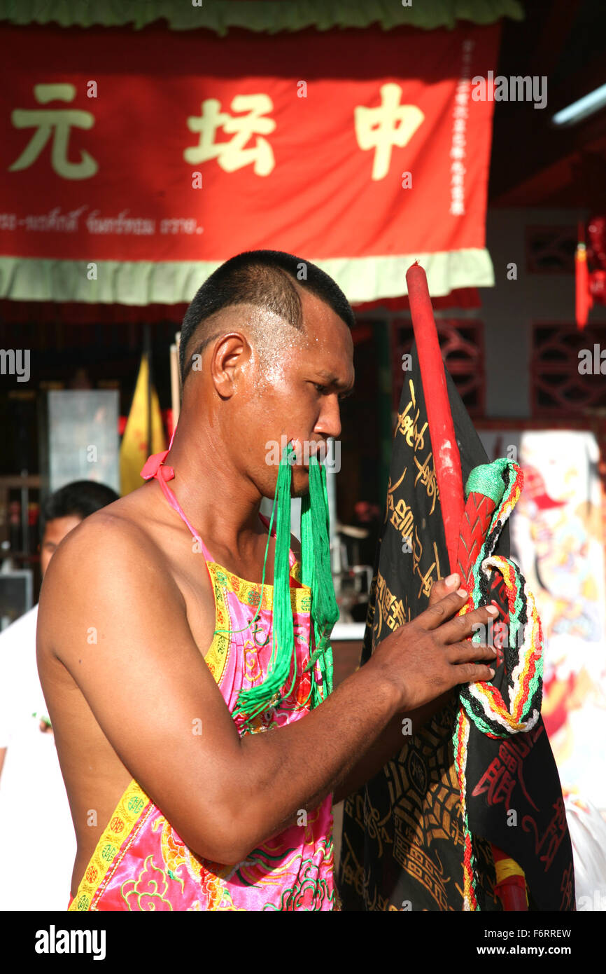 Thailand Phuket Festivals A Mah Jong going through the ritual of face ...