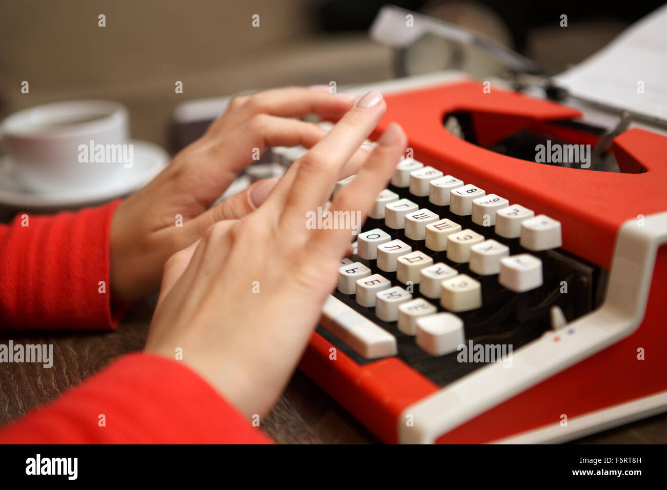human hands writing on old red typewriter Stock Photo - Alamy