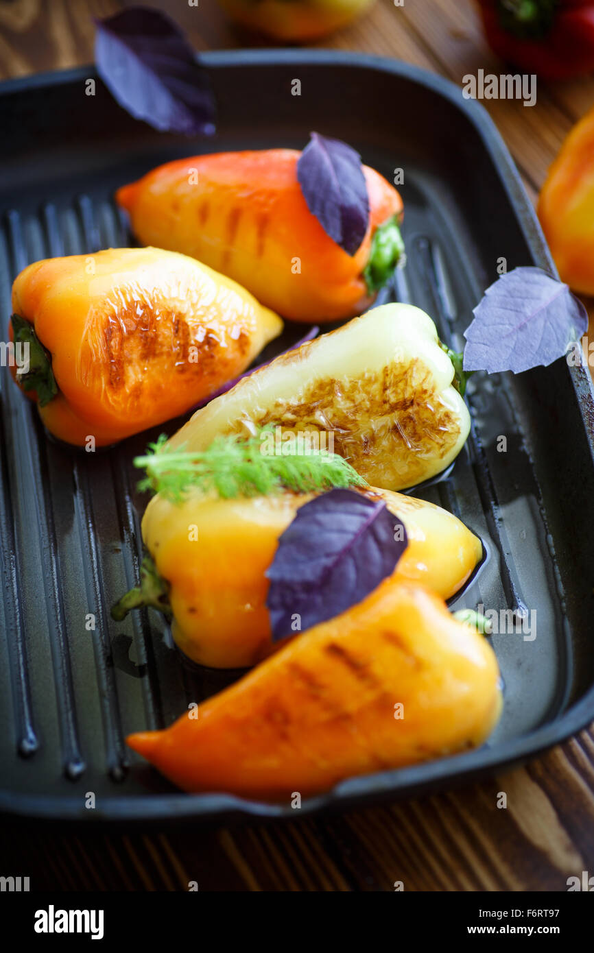pepper fried in oil in a frying pan Stock Photo - Alamy