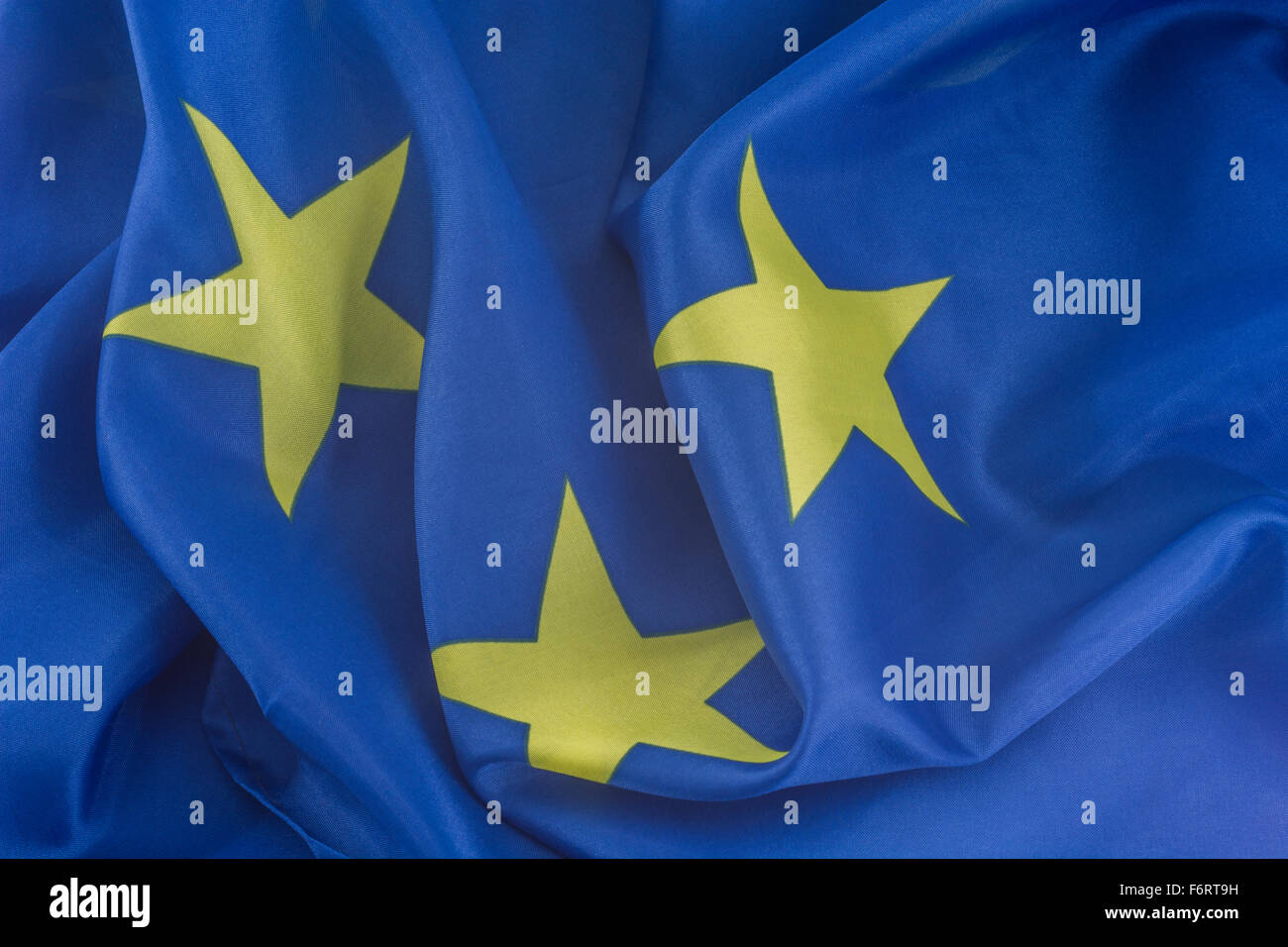 Ruffled yellow stars of the EU / European Union flag symbolizing ...