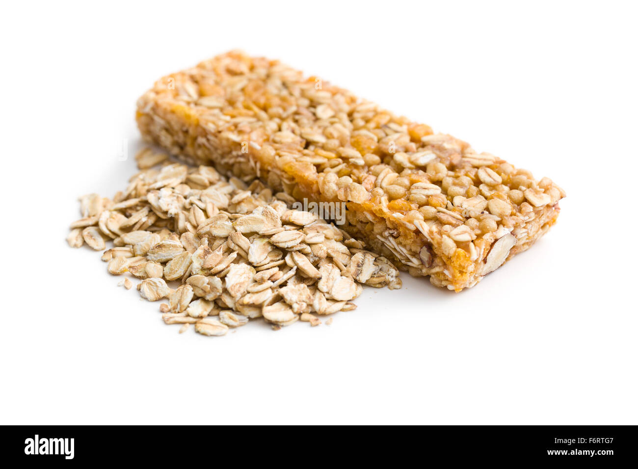 muesli bar and oat flakes on white background Stock Photo - Alamy