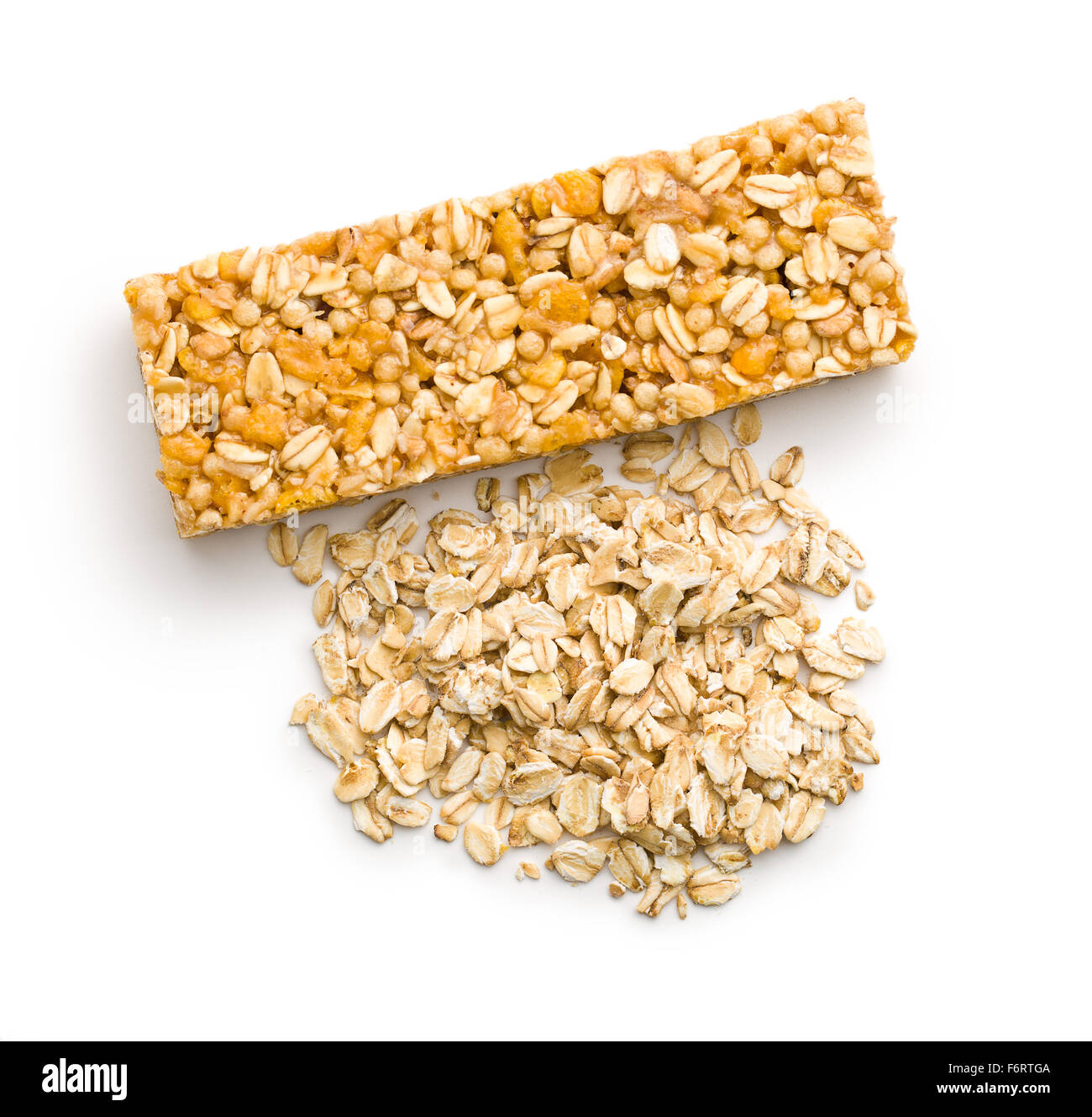 muesli bar and oat flakes on white background Stock Photo - Alamy
