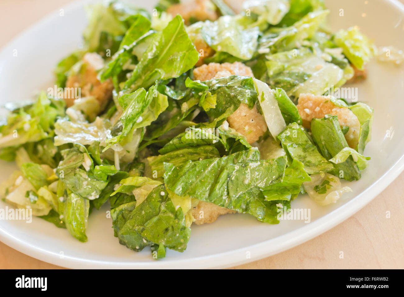 Fresh organic caesar salad with grated asiago cheese Stock Photo - Alamy