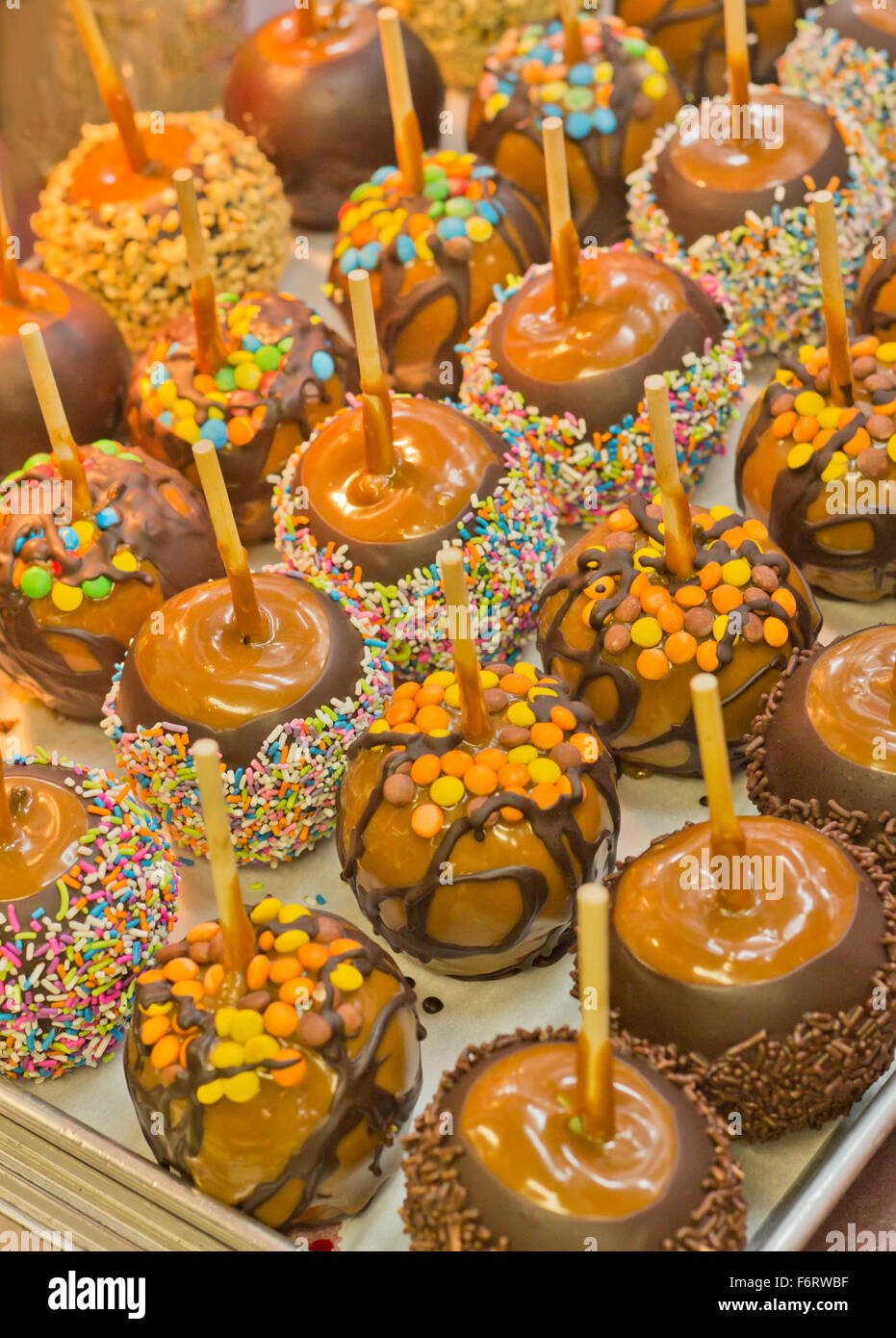 Tray of assorted variety of candy apples at state fair Stock Photo - Alamy