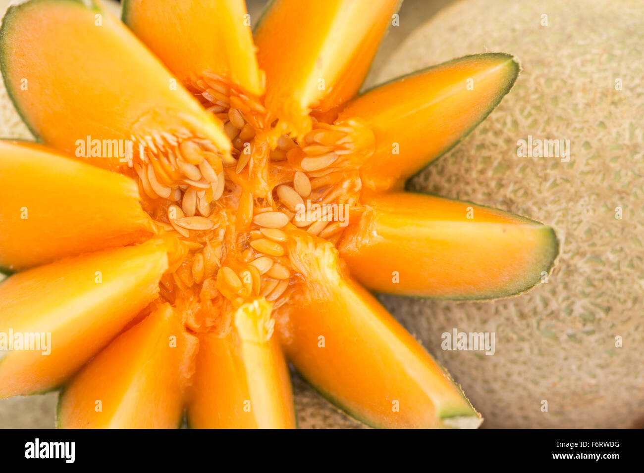 Fresh fancy sliced cantaloupe melon on display at local farmers market ...