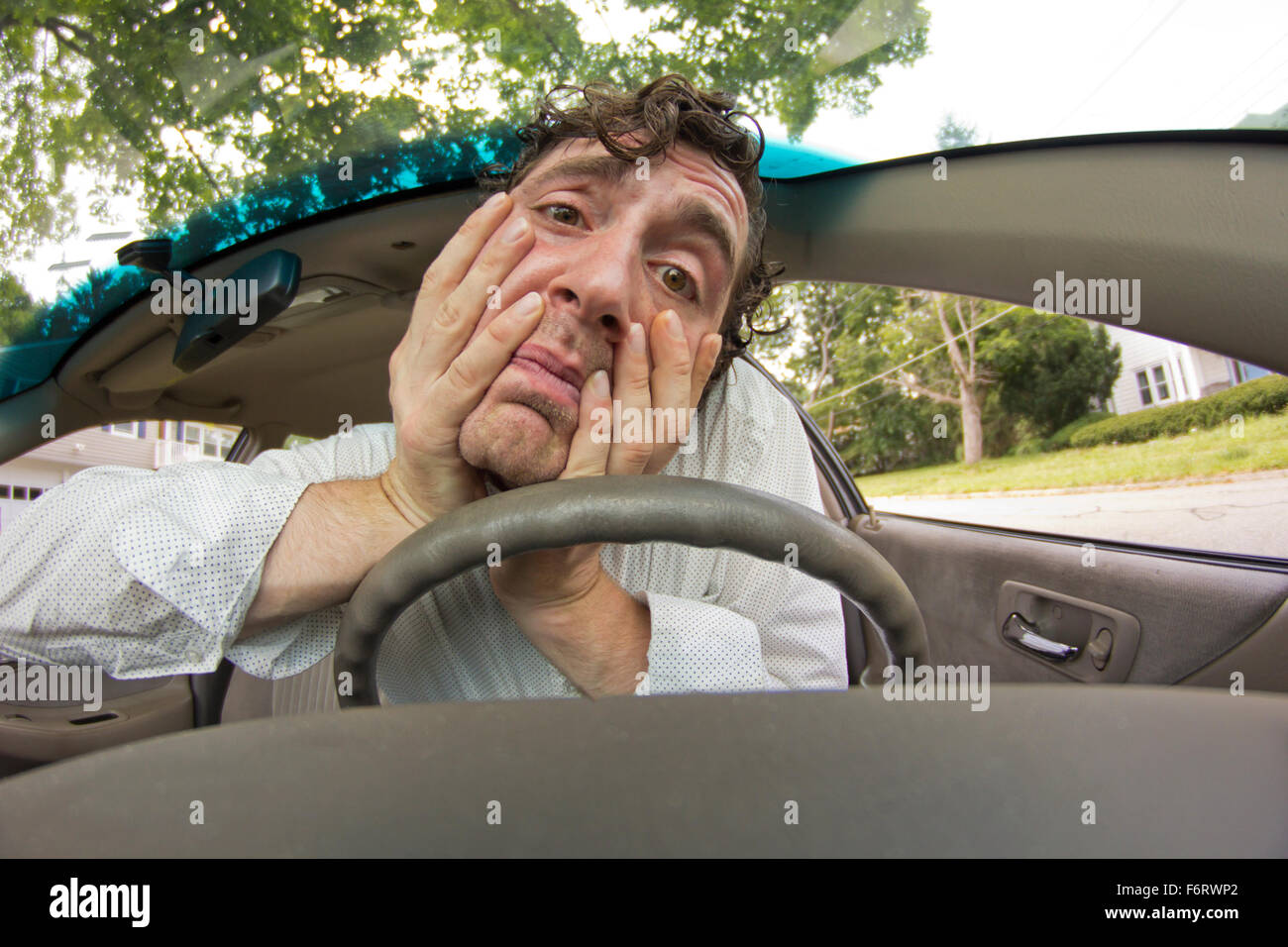Silly man gets into car crash and makes ridiculous face Stock Photo - Alamy