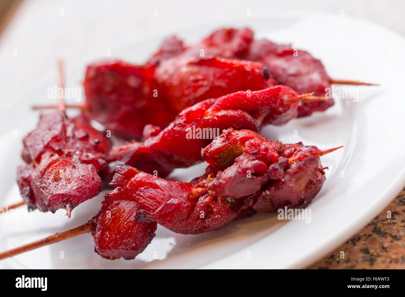 Restaurant style Chinese red chicken kebabs Stock Photo - Alamy