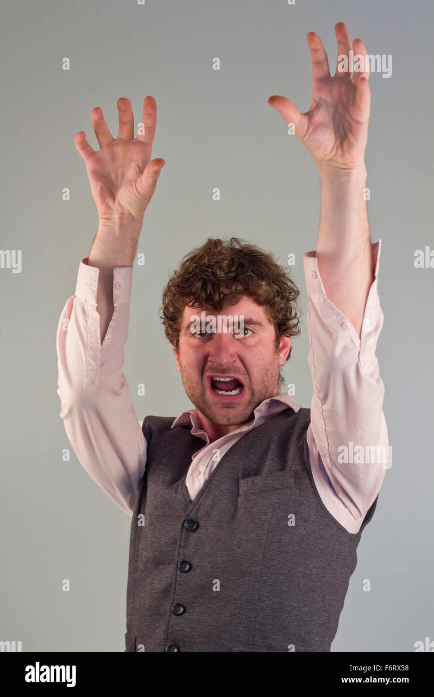 Man acting like an animal by growling snarling and clawing Stock Photo ...