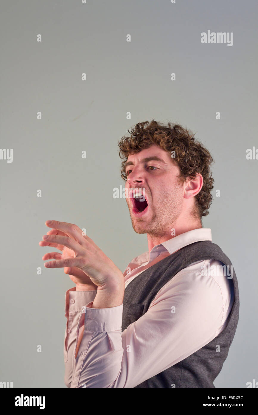 Man acting like an animal by growling snarling and clawing Stock Photo ...