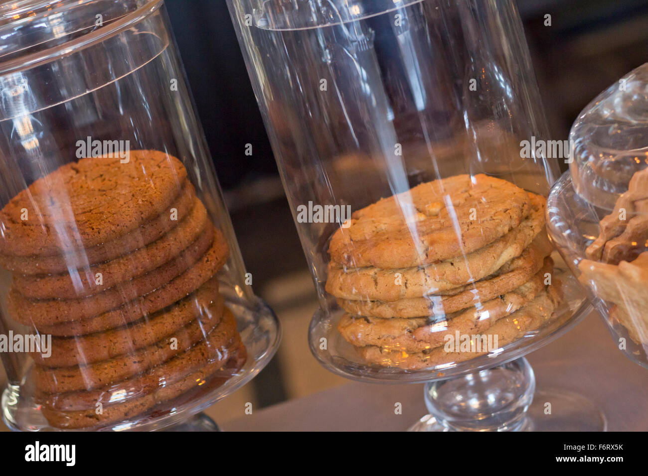 Peanut butter cookies in ornate glass bakery display Stock Photo - Alamy