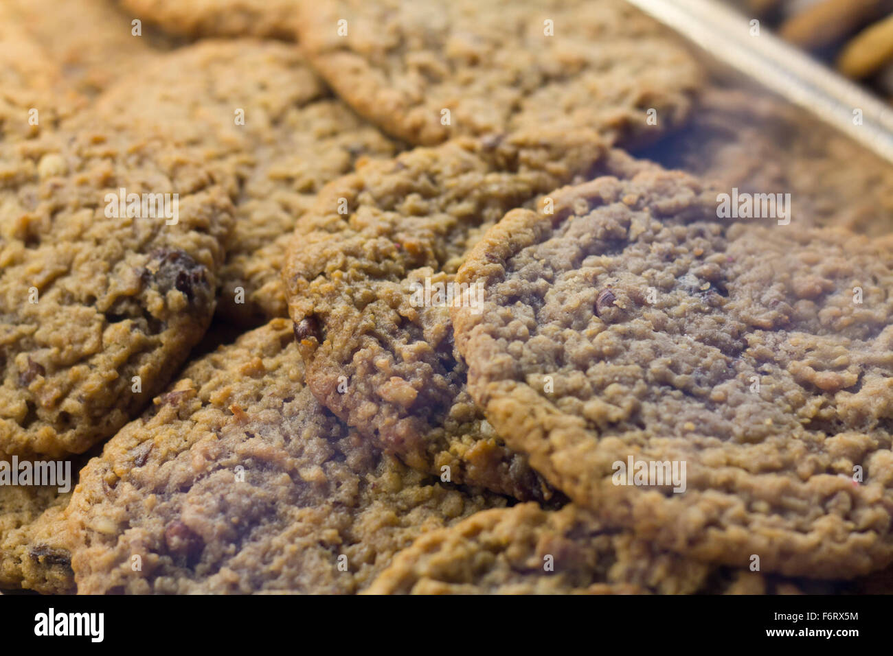 Fresh oatmeal cookies in pile on display at local bakery Stock Photo ...