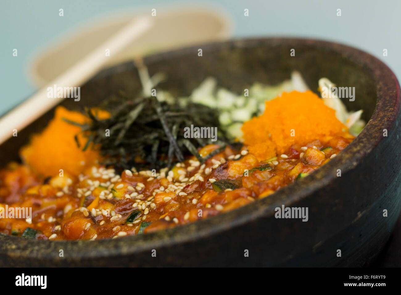 Fresh authentic Korean nakji bibimbap in hot steaming bowl Stock Photo ...