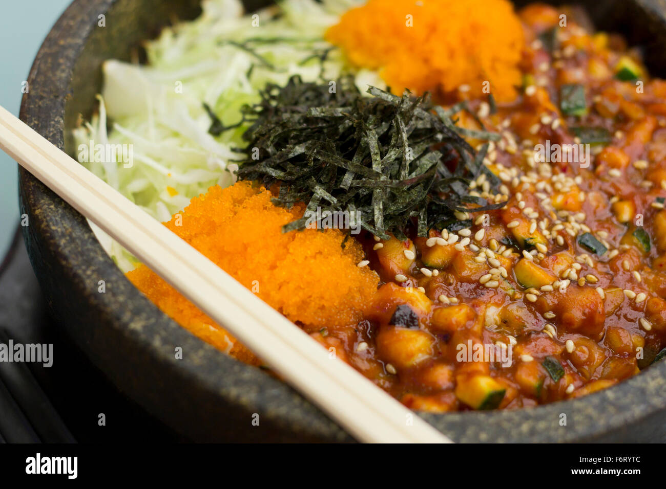 Fresh authentic Korean nakji bibimbap in hot steaming bowl Stock Photo ...
