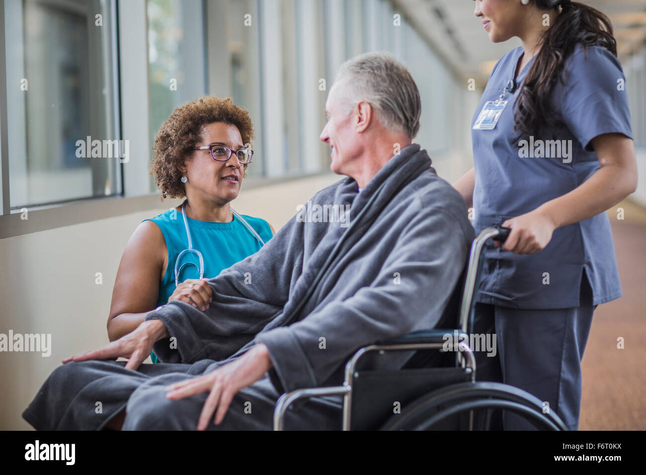 Doctor talking patient sitting in hi-res stock photography and images ...