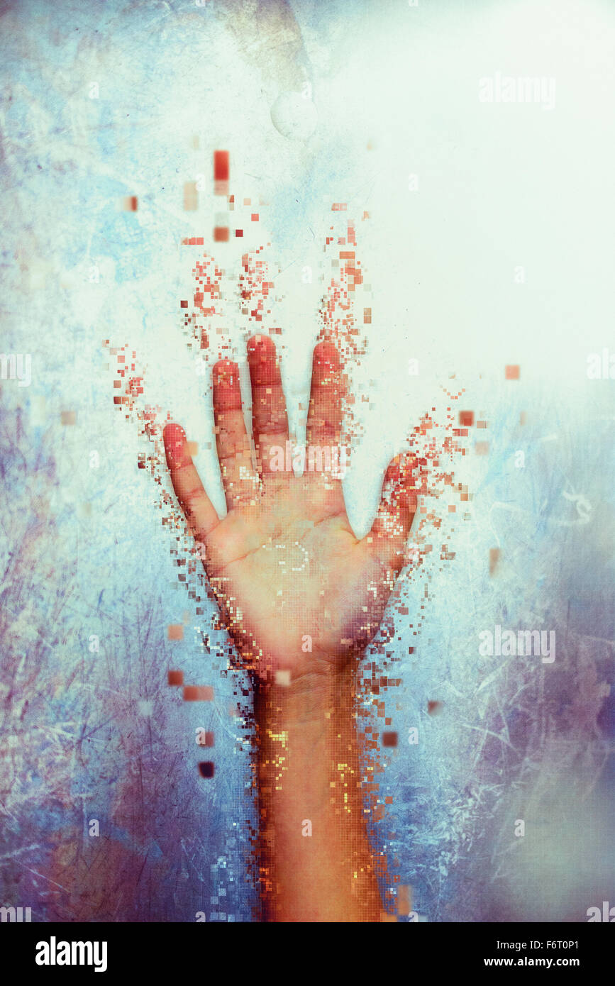 Pixelated hand dissolving Stock Photo - Alamy