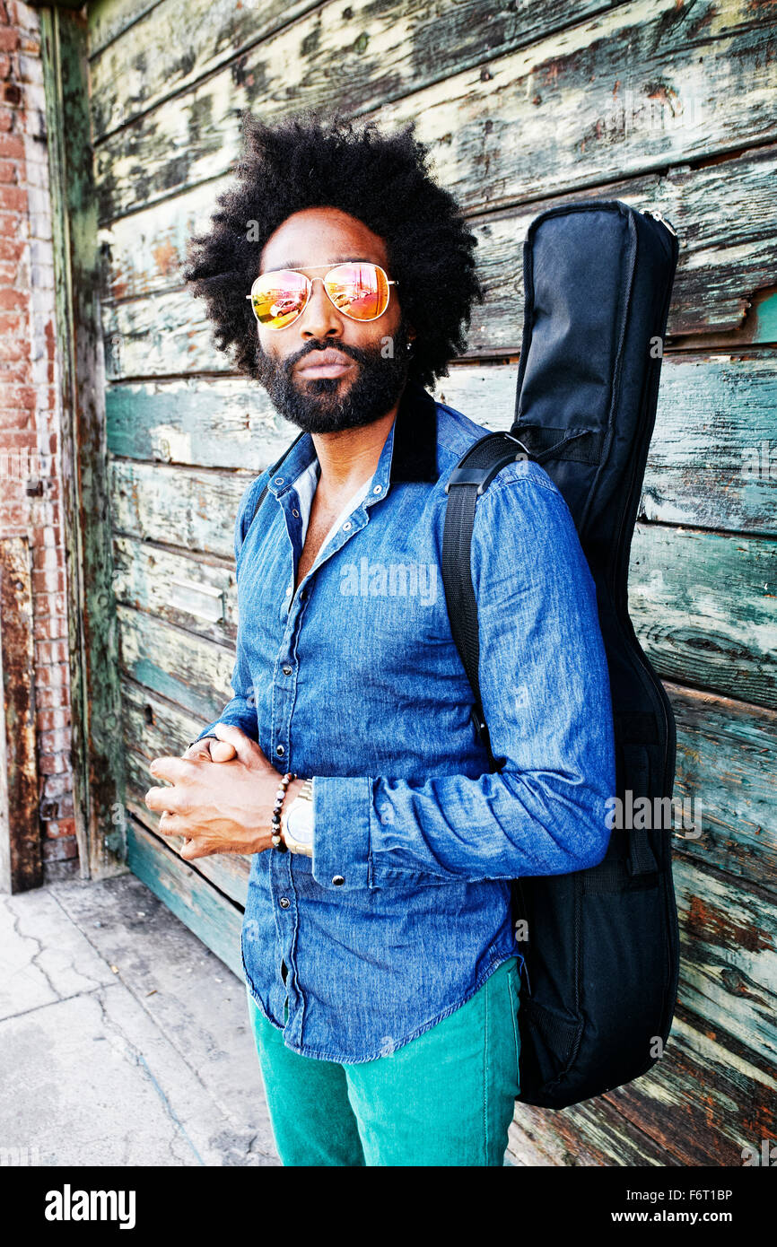 Man carrying guitar hi-res stock photography and images - Alamy