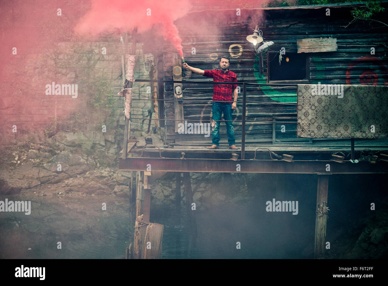 Caucasian man spraying pigment powder Stock Photo - Alamy