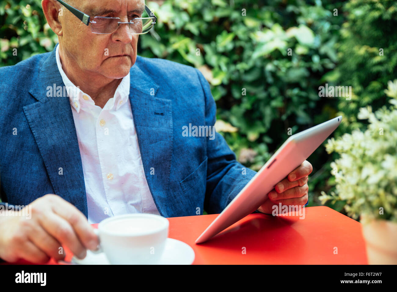 Businessman using tablet on table hi-res stock photography and images ...