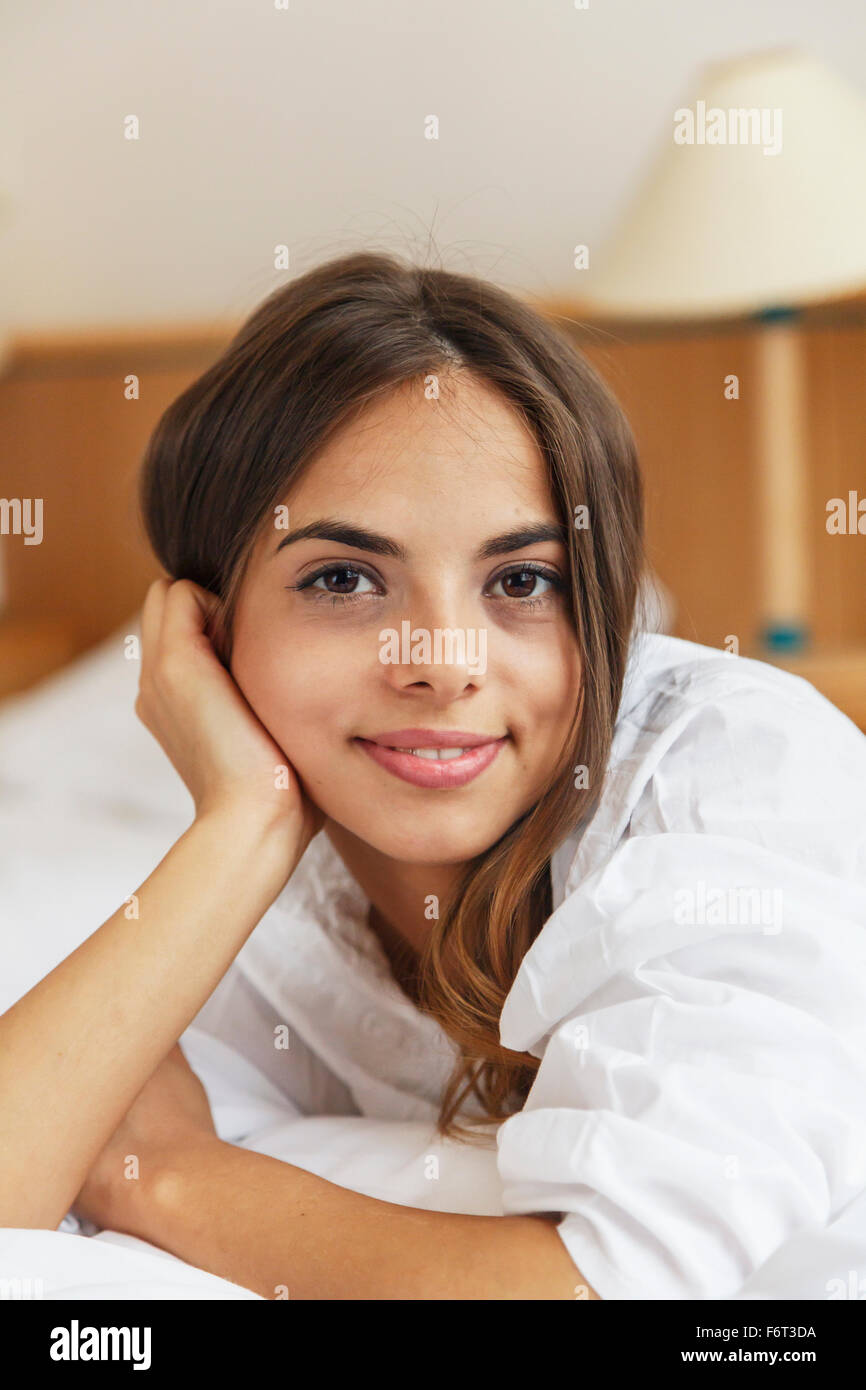 Caucasian woman smiling in bed Stock Photo - Alamy