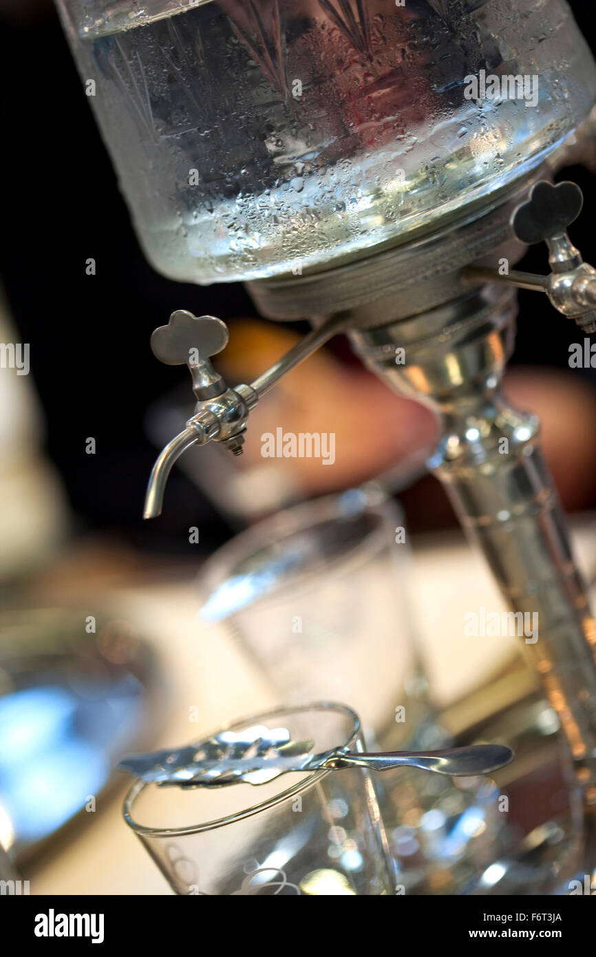 Tap and spoon to drink absinthe at a bar Stock Photo - Alamy