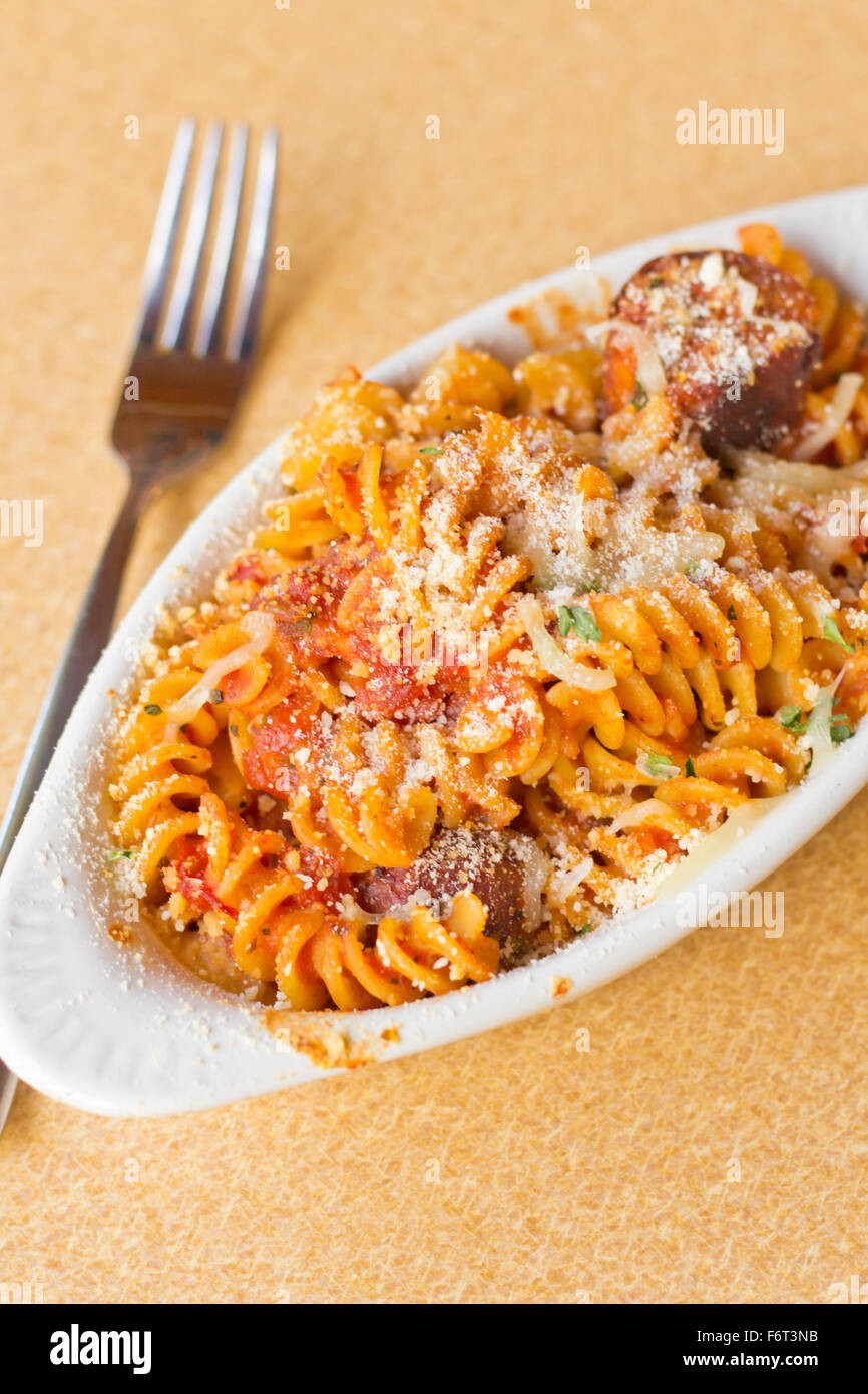 Spiral pasta with sausage in tomato sauce with fresh parmesan romano ...