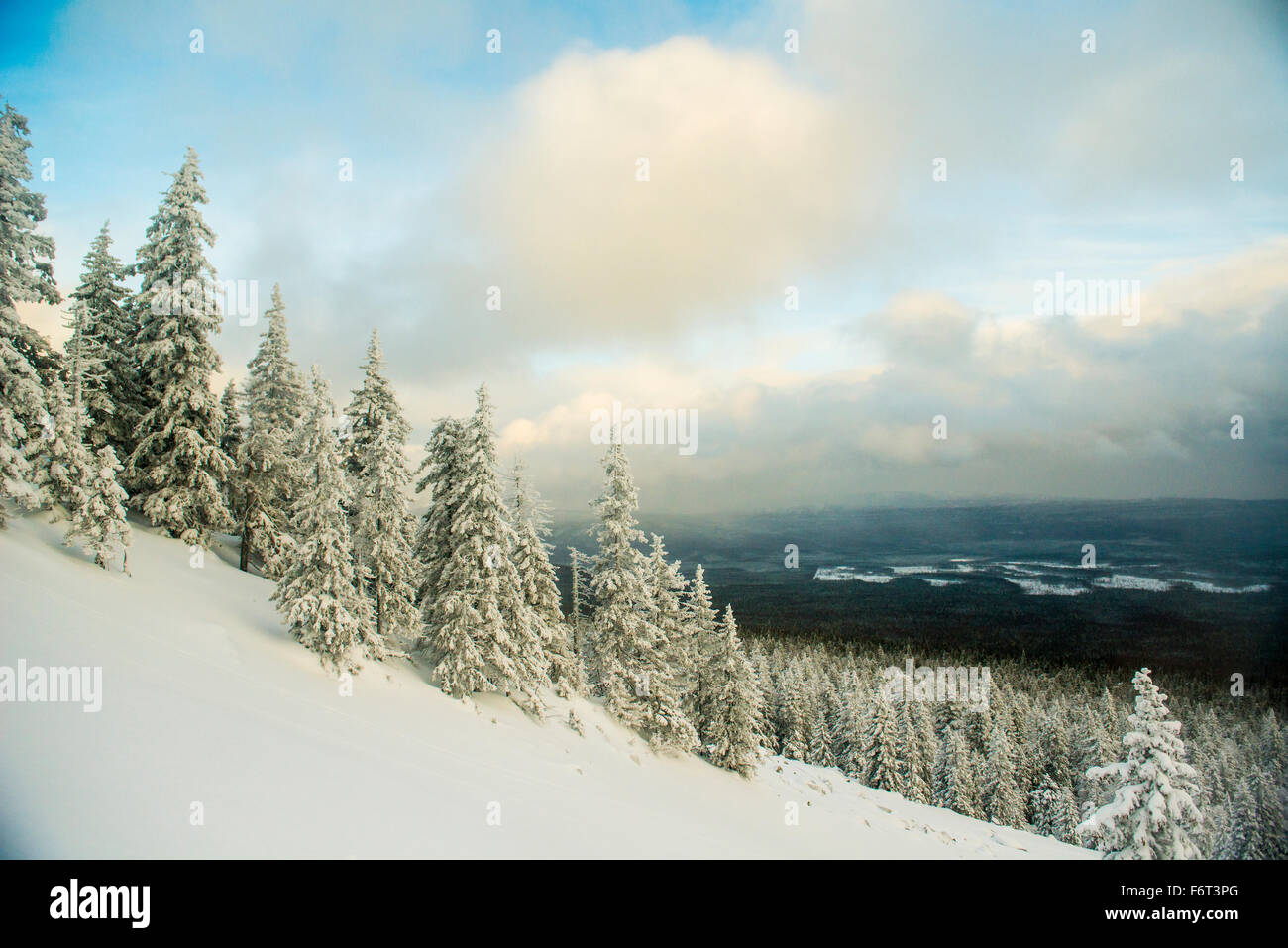 Snowy hillside over remote landscape Stock Photo - Alamy