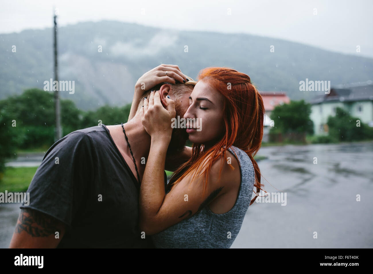 beautiful couple hugging in the rain Stock Photo - Alamy